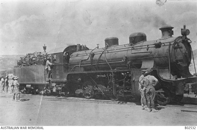Light Horsemen inspecting the Lockington engine. | Australian War Memorial