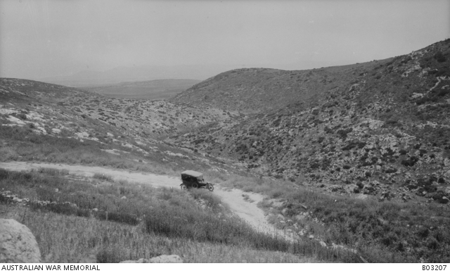 A Model T Ford travelling on the road through Mus Mus Pass ...