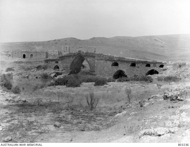 Jisr al Majami. View of an old Roman bridge. Two men are on the bridge ...