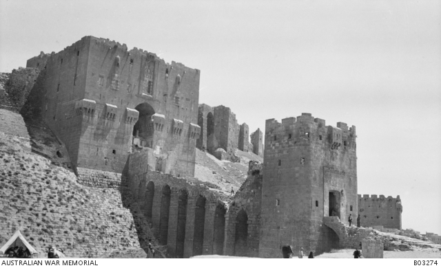 The ancient Citadel. A person can be seen walking above the arches on ...