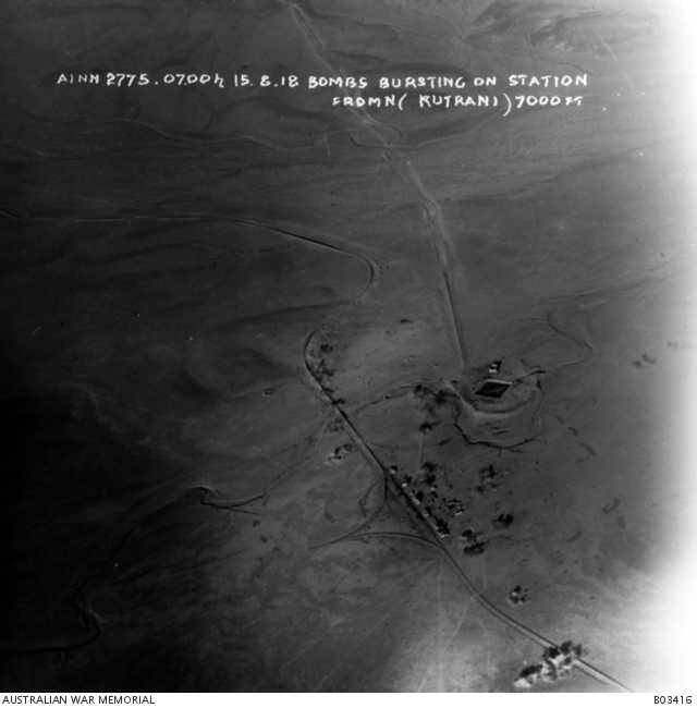 Aerial photograph of bombs exploding on the railway station north of ...