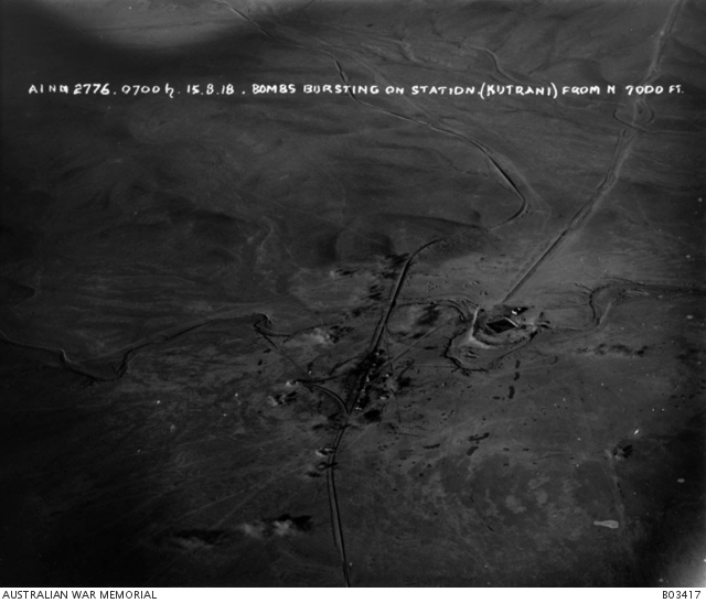 Aerial photograph of bombs exploding on the railway station north of ...