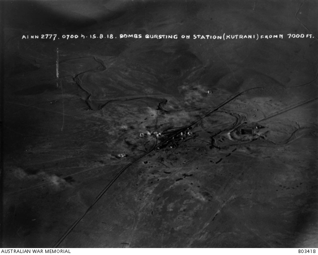 Aerial photograph of bombs exploding on the railway station north of ...