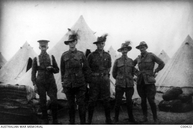 Group portrait of five members of the second reinforcements to the 5th ...