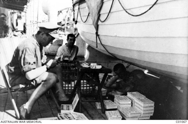 Three unidentified soldiers on board the transport ship HMAT Kanowna ...