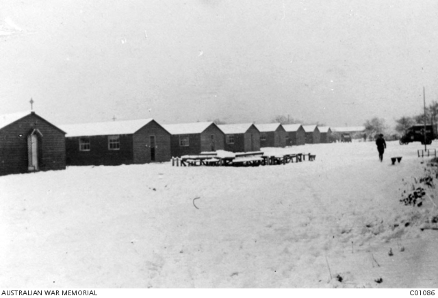 A row of huts at Abbey Wood Camp, near London, during winter. On the ...