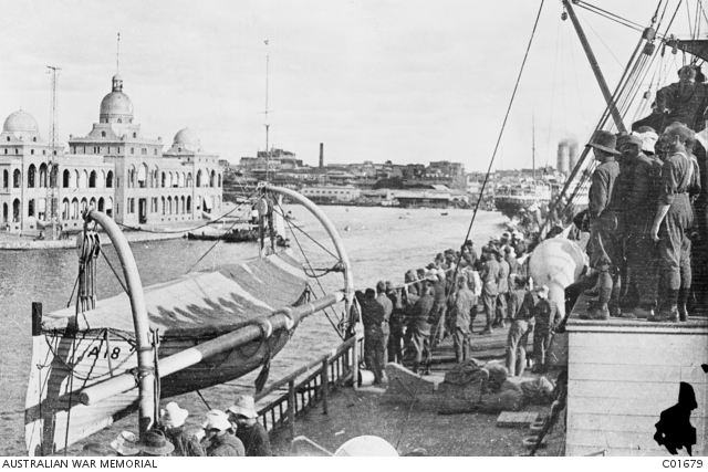 Australian troops look at the Egyptian port from the deck of their ...