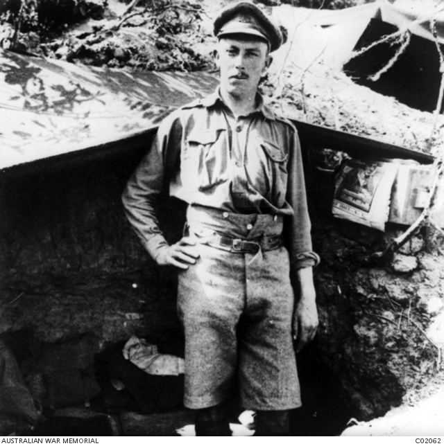 Portrait of Captain Harold Jacobs, 1st Battalion, standing outside a ...