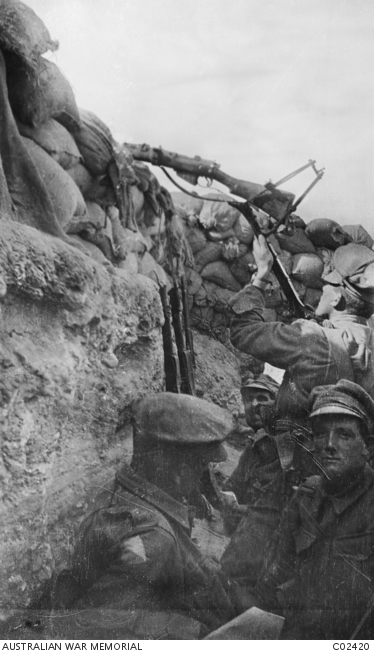 An unidentified soldier operating a periscope rifle in a trench on the ...
