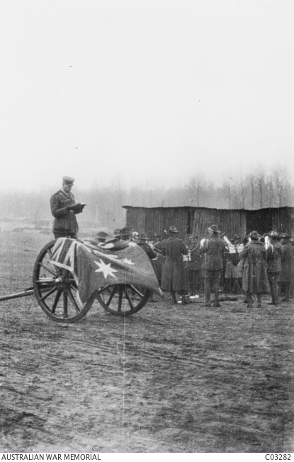 A chaplain, possibly Reverend Ernest Northcroft Merrington, conducting ...