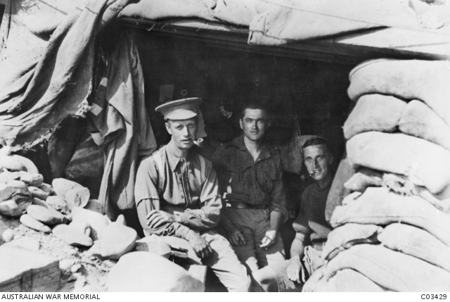 Three clerks employed at Anzac Corps Headquarters, in their dugout on ...
