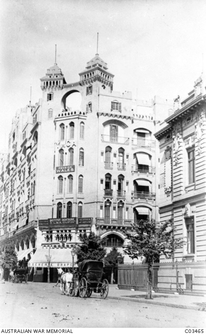 A horse drawn carriage approaching the YMCA Anzac Hostel building in ...