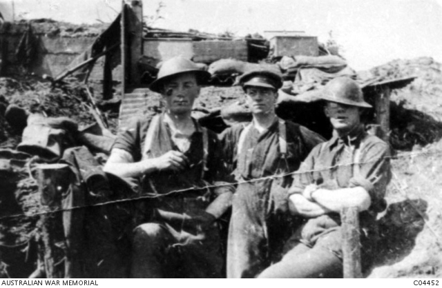 Group portrait of three officers of the 13th Battalion, AIF. They are ...