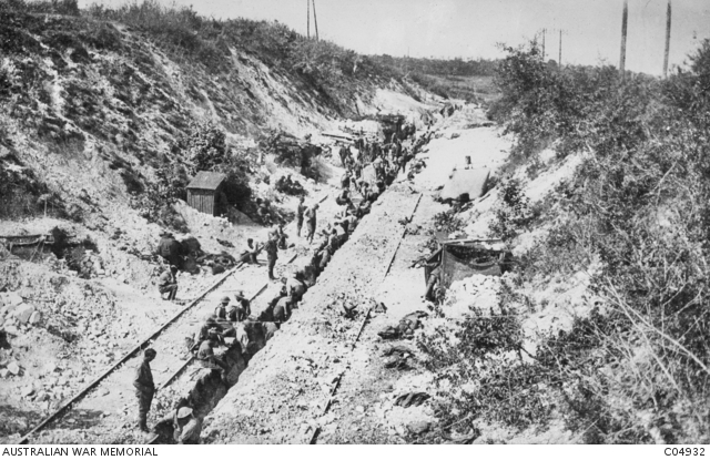 A party of the 6th Australian Infantry Brigade digging a trench for a ...