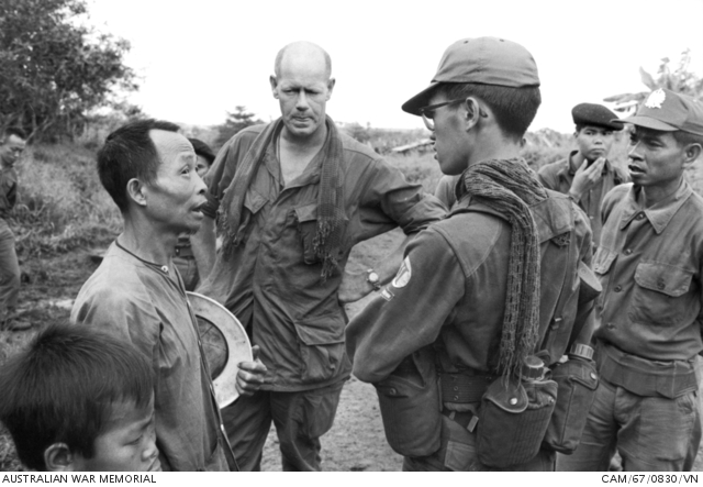 Vietnam. 1967-09. An interpreter aids Regimental Sergeant Major Larry ...