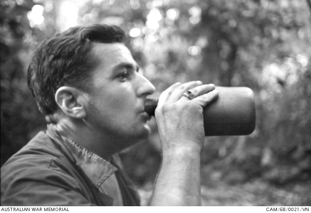 South Vietnam. 1968-01. Private Dennis Dillon of Como, WA, takes time ...