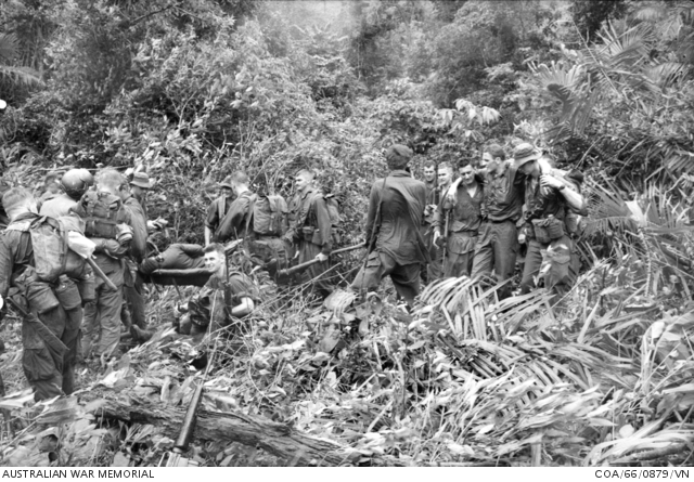 PHUOC TUY PROVINCE, VIETNAM. 1966-10-08. TREATING IN THICK JUNGLESOME ...
