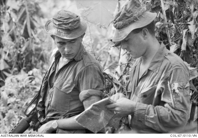 A quick map check by corporal Daryle Poke of Smithton, Tas (left), and ...