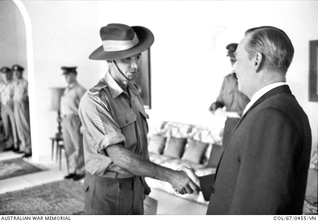Sergeant Francis Alcorta of Newmarket, Qld (left), is congratulated by ...