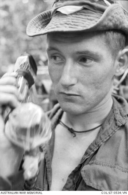 Vietnam. 1967-07. Private Conrad Becker of Moorabbin, Vic, sends a message with a wireless ...