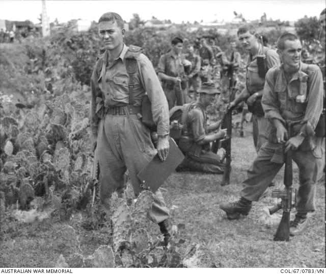 Troops of 7th Battalion, The Royal Australian Regiment (7RAR) wait in ...