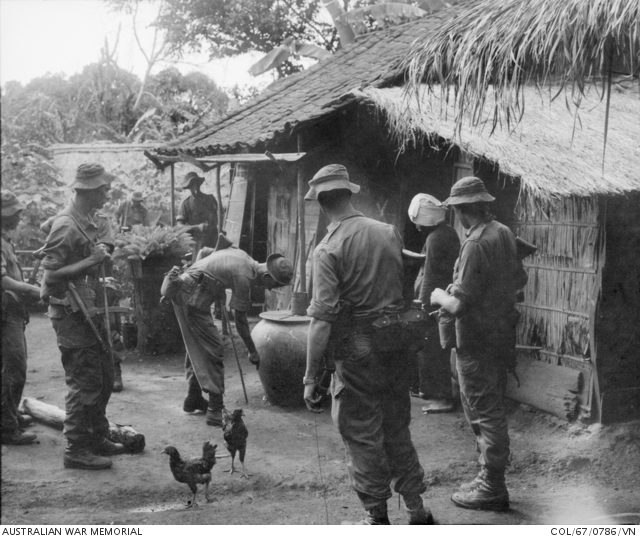Troops of 7th Battalion, The Royal Australian Regiment (7RAR) searching ...