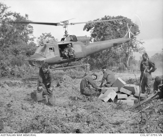 Troops of 7th Battalion, The Royal Australian Regiment (7RAR), dodge ...
