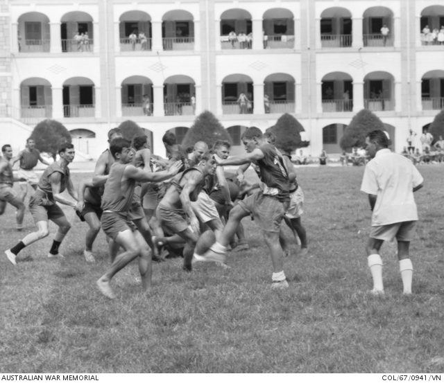 Vung Tau, Vietnam. 1967-10. Players competing for the football in a ...