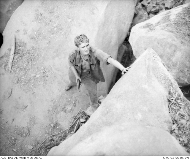 Phuoc Tuy Province, South Vietnam. 1968-03. Private David Millhouse of Hobart, Tas, searches in ...