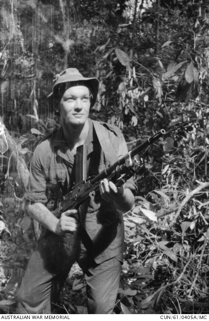 Armed with a 7.62mm L4A4 Bren light machine gun (LMG), an unidentified ...