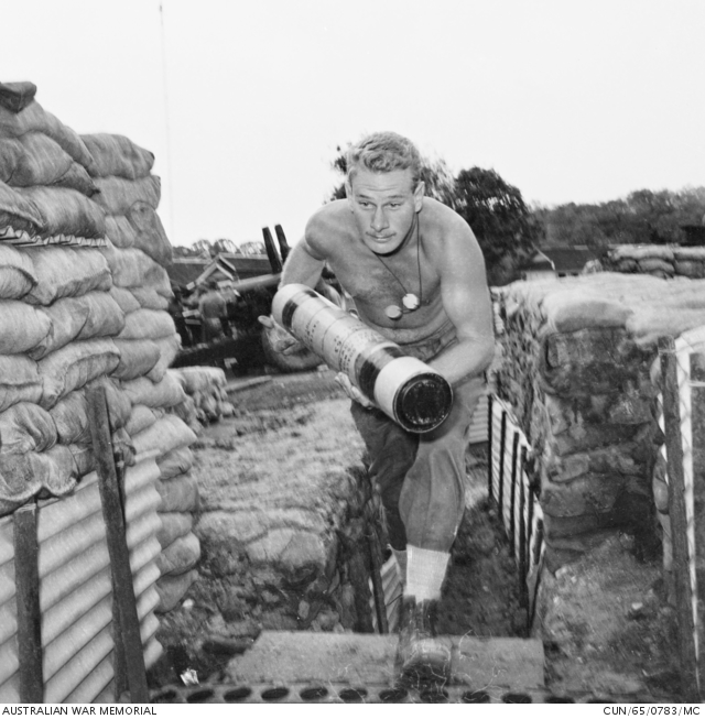 Bringing up ammunition for a 105mm L5 Pack Howitzer during an artillery ...
