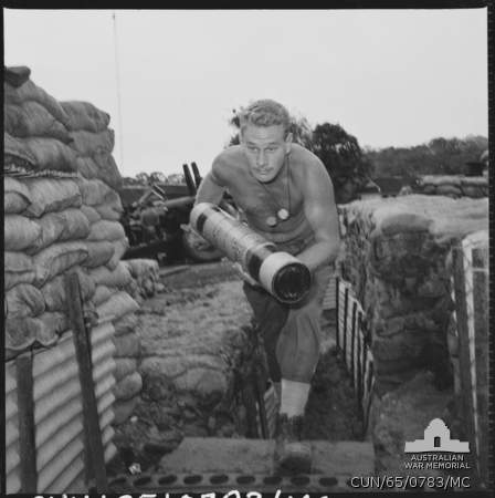 Bringing up ammunition for a 105mm L5 Pack Howitzer during an artillery ...