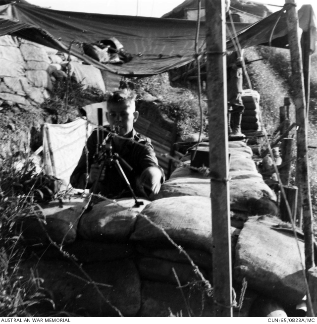 Armed with an L4A4 Bren gun and manning his position reinforced with ...