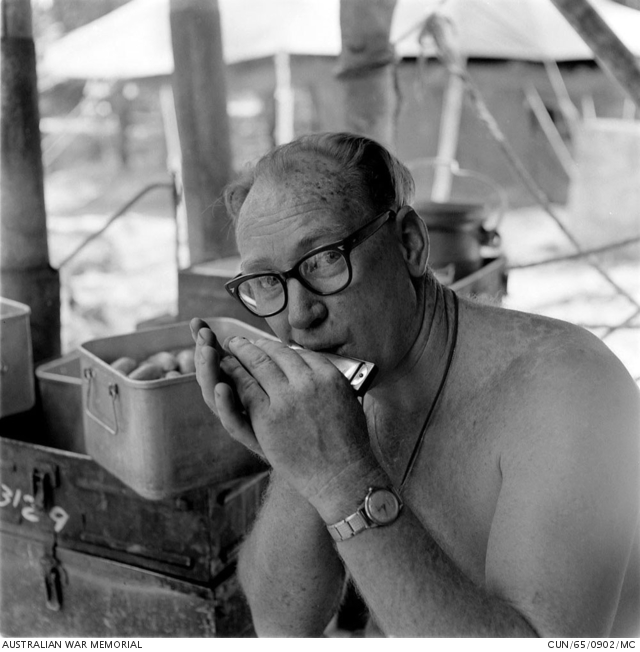 Enjoying a tune on the harmonica is 41709 Private (Pte) Leonard Roy ...