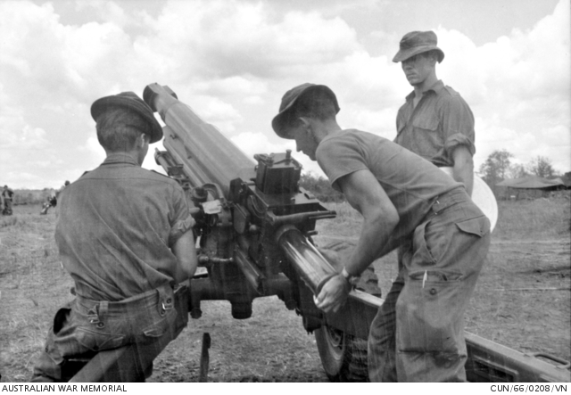 Vietnam. 1966-03-18. Gunner Ken Gann of Inala, Brisbane, Qld, loads one ...