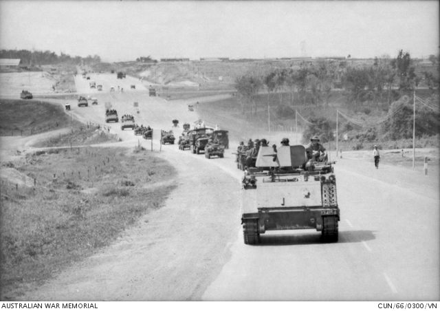 Australian convoy escorted by M113 armoured personnel carriers on a ...
