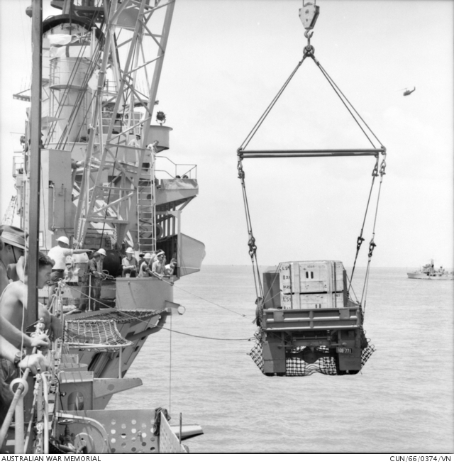 Vung Tau, Vietnam. 1966-05. Loading vehicles into landing craft from ...