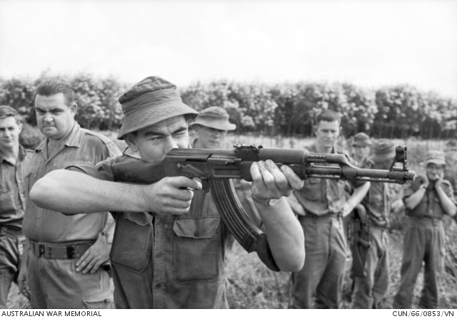 Vietnam. 1966-10. Evaluating a captured communist Chicom assault rifle ...