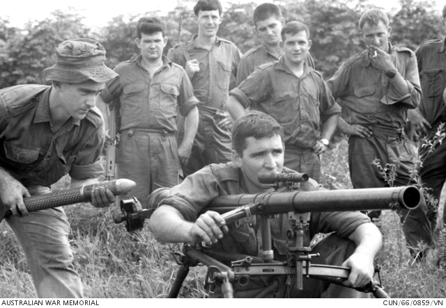 Phuoc Tuy Province, Vietnam. 1966-10. Loading a captured communist ...