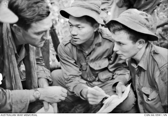 Vietnam. 1966-11-28. A three way discussion for Captain Peter Harris of ...