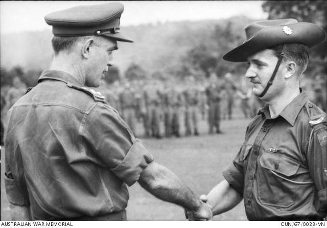 Nui Dat, Vietnam. 1967-01. A Mentioned-in-Despatches rosette is pinned ...