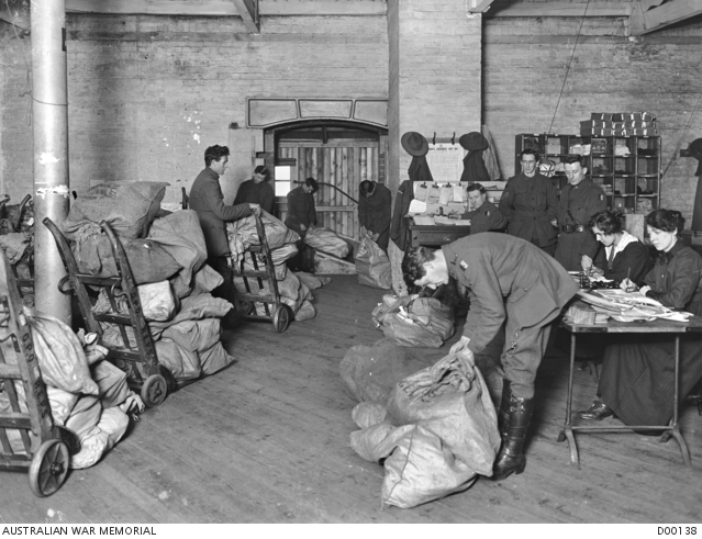 Checking and despatching mail bags down the chute to motor lorries ...
