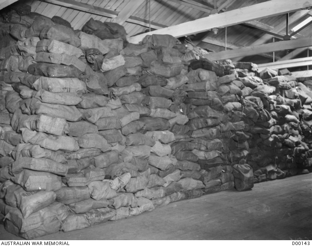 A portion of a huge stack of over 30,000 bags of Australian parcels at ...
