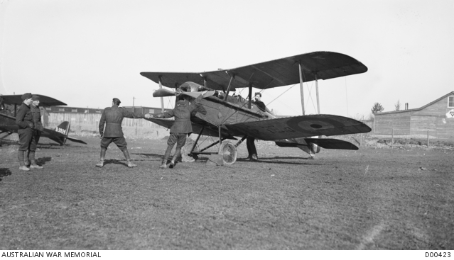 Mechanics starting the engine of a S.E.5A (Hispano Suiza engine ...