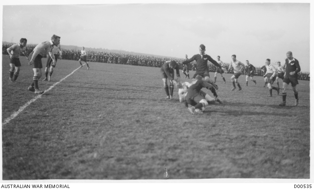 A player is tackled in the Army rugby football match between New ...