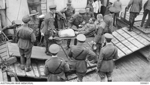 General Sir William Birdwood (on gangplank, cap off), showing a ...