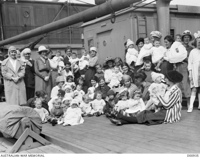 Informal group portrait of wives and babies on board the SS Borda ...
