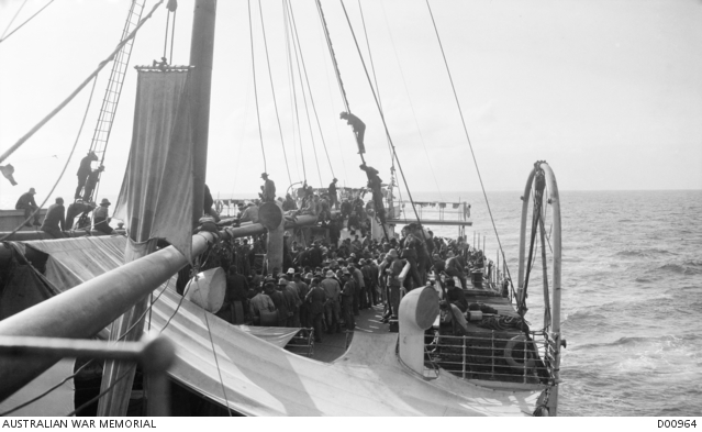 Soldier spectators watching Tug-of-War, on board HMAT Euripides during ...