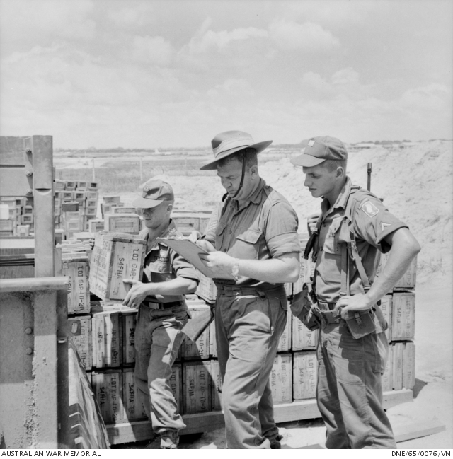 BIEN HOA, VIETNAM. 1965-06. SERGEANT ALAN HARNEY, OF SYDNEY, CHECKS ...