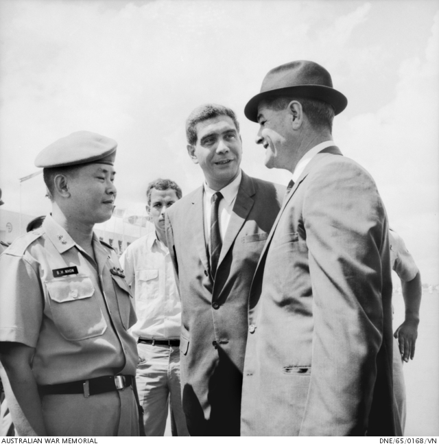 An informal conversation on the tarmac at Tan Son Nhut airfield. Left ...